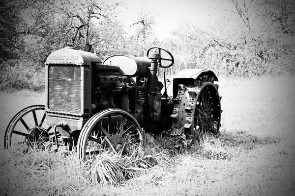 Tractor: A little old school workhorse...This is a tractor in a feild ...