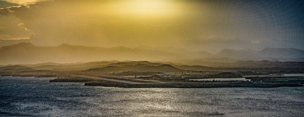 Airfield at sunset, Leeward side, Guantanamo Bay, Cuba: Planes come in ...