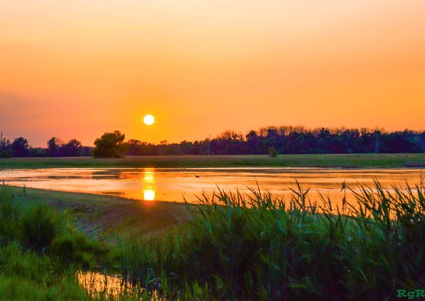 Setting sun over the marsh: I was at the marsh watching the sunset.