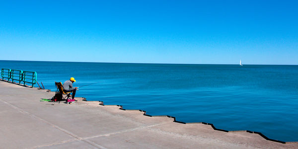 A Potential Fish Story: Lake Michigan: Fishing off the pier in Racine, WI.