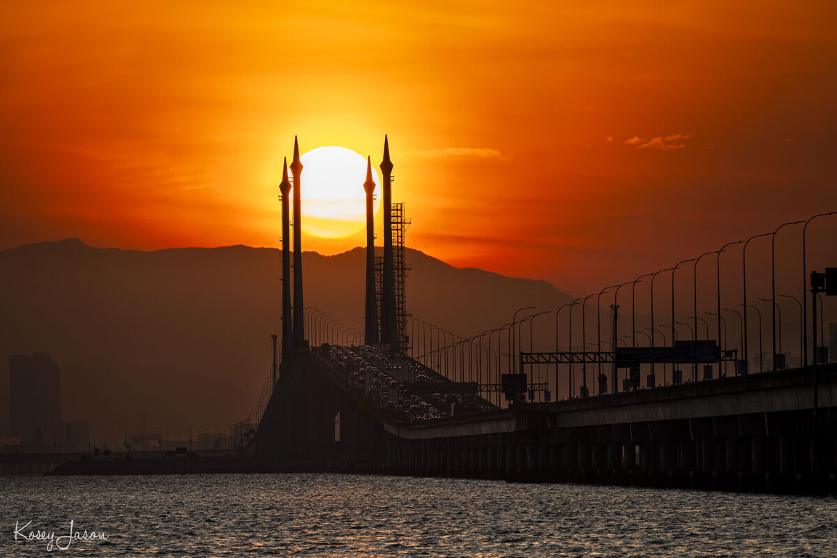 Penang Bridge sunrise: This is an annual occurrence where the sun sets ...