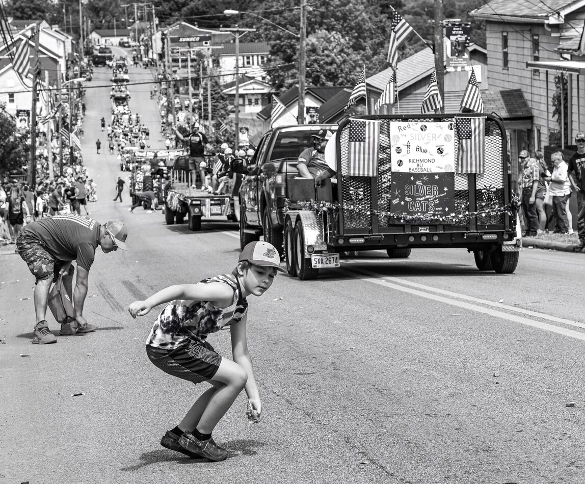 The candy gleaners: Yesterday's Memorial Day parade.