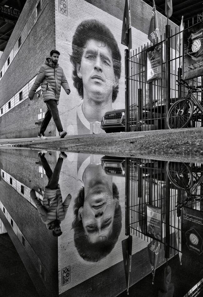 Water Reflection: Reflection on a rain puddle in NYC.