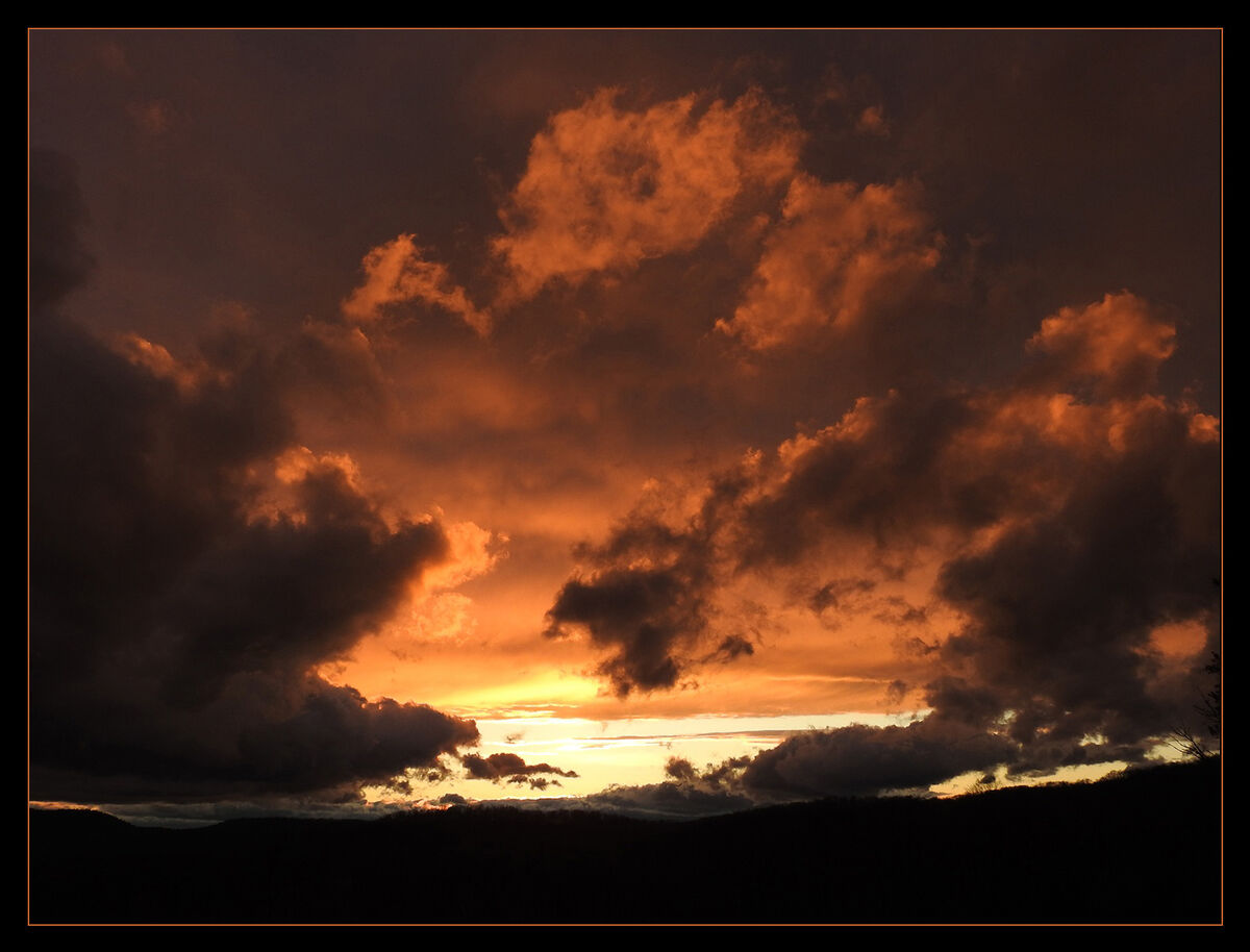 Storm Front Leaving At Sunset: Hidden behind the dark clouds the ...